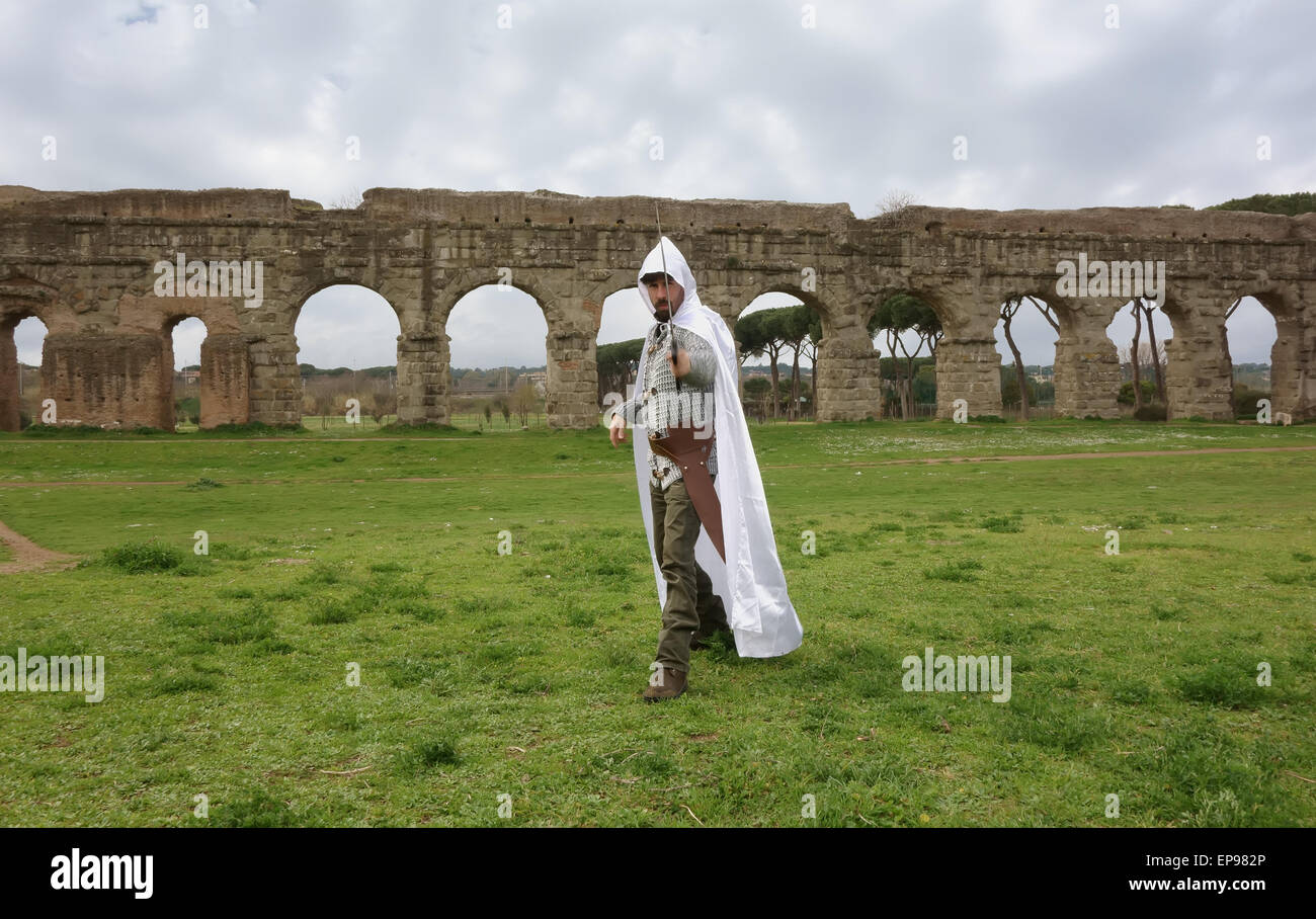 Medieval knight under ancient Roman ruins and stormy sky Stock Photo ...