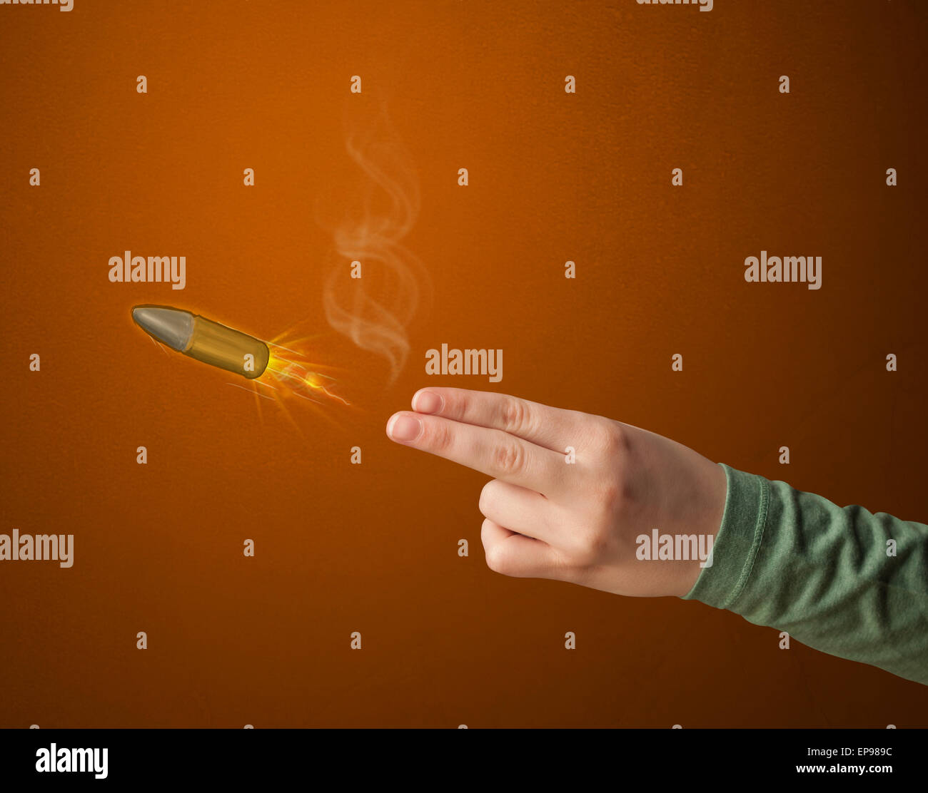 Gun shaped woman hand with bullet Stock Photo - Alamy