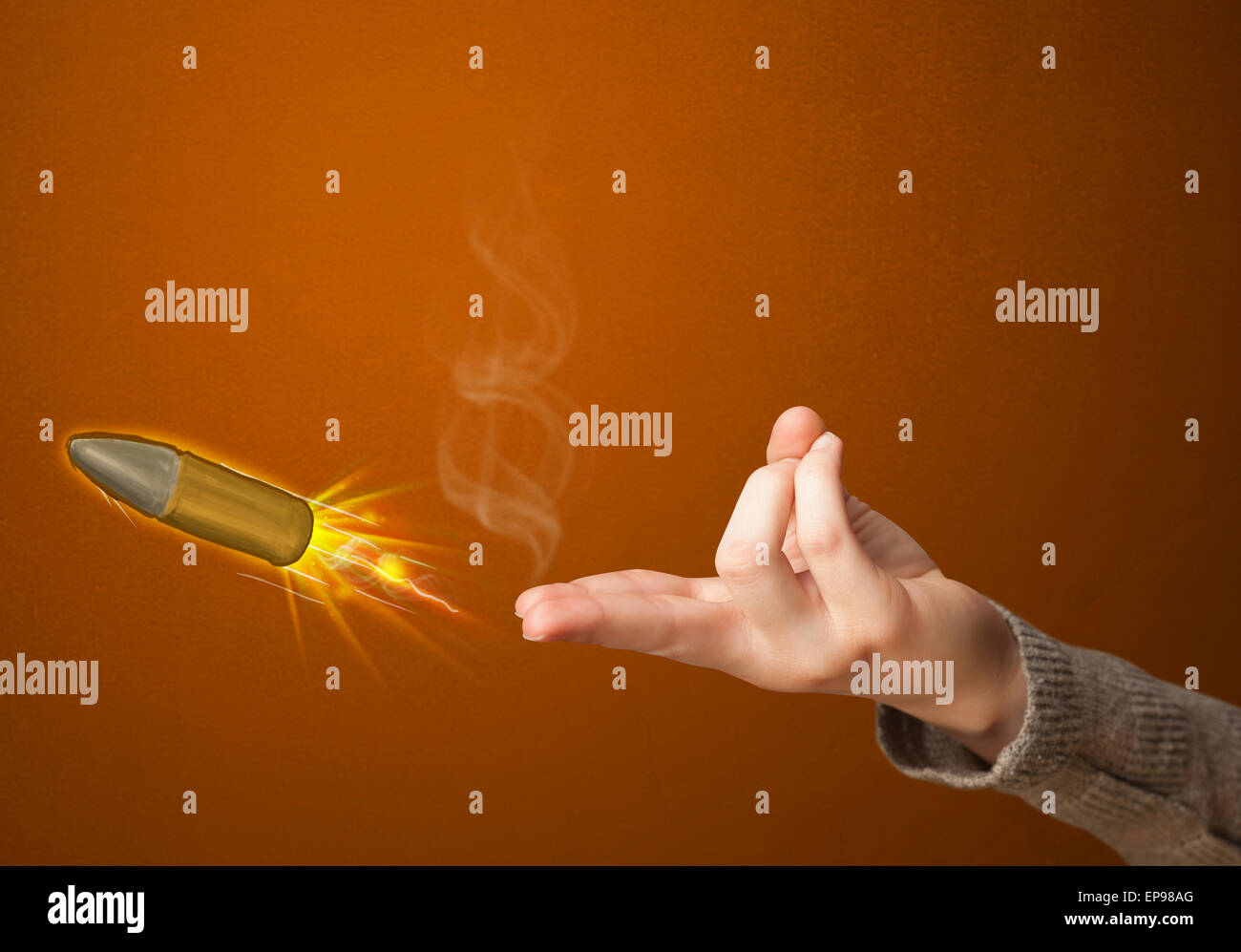 Gun shaped woman hand with bullet Stock Photo - Alamy