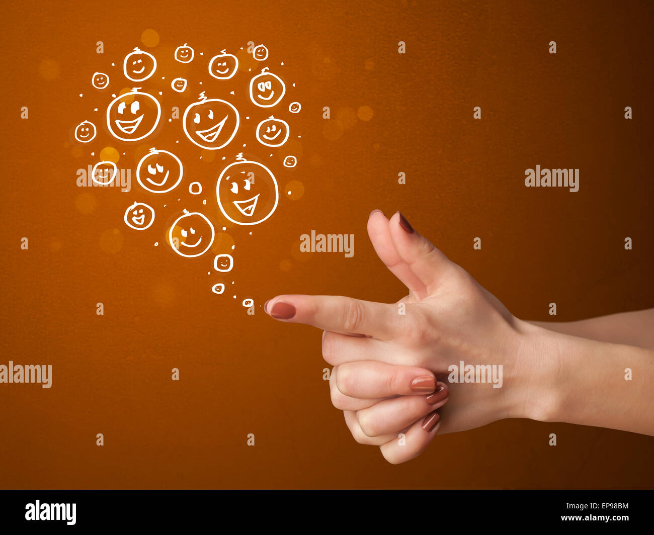 Group of happy smiley faces coming out of gun shaped hands Stock Photo ...