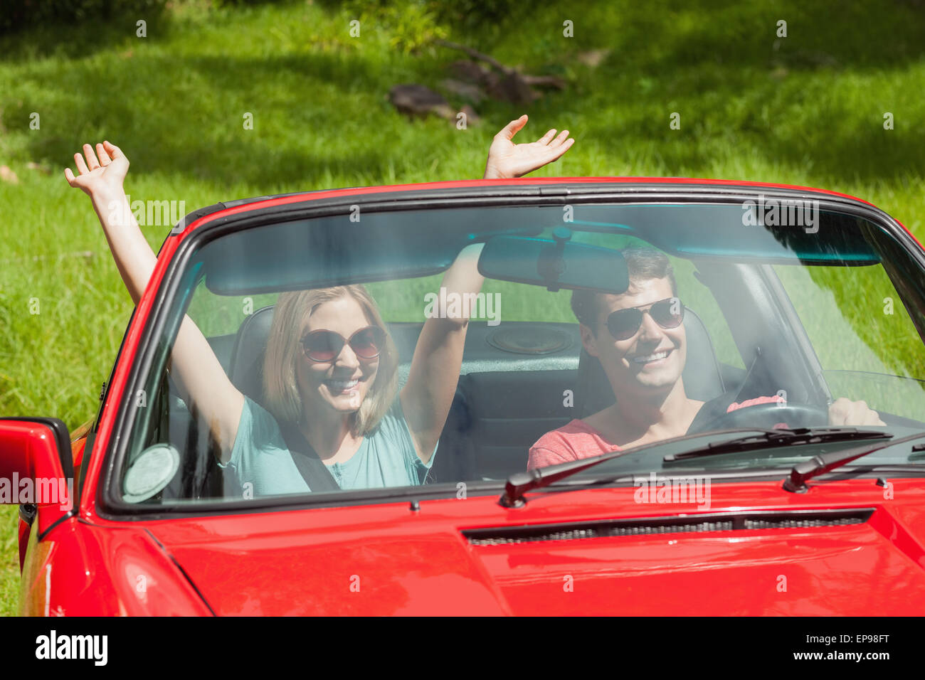 Smiling young couple going for a ride together Stock Photo - Alamy