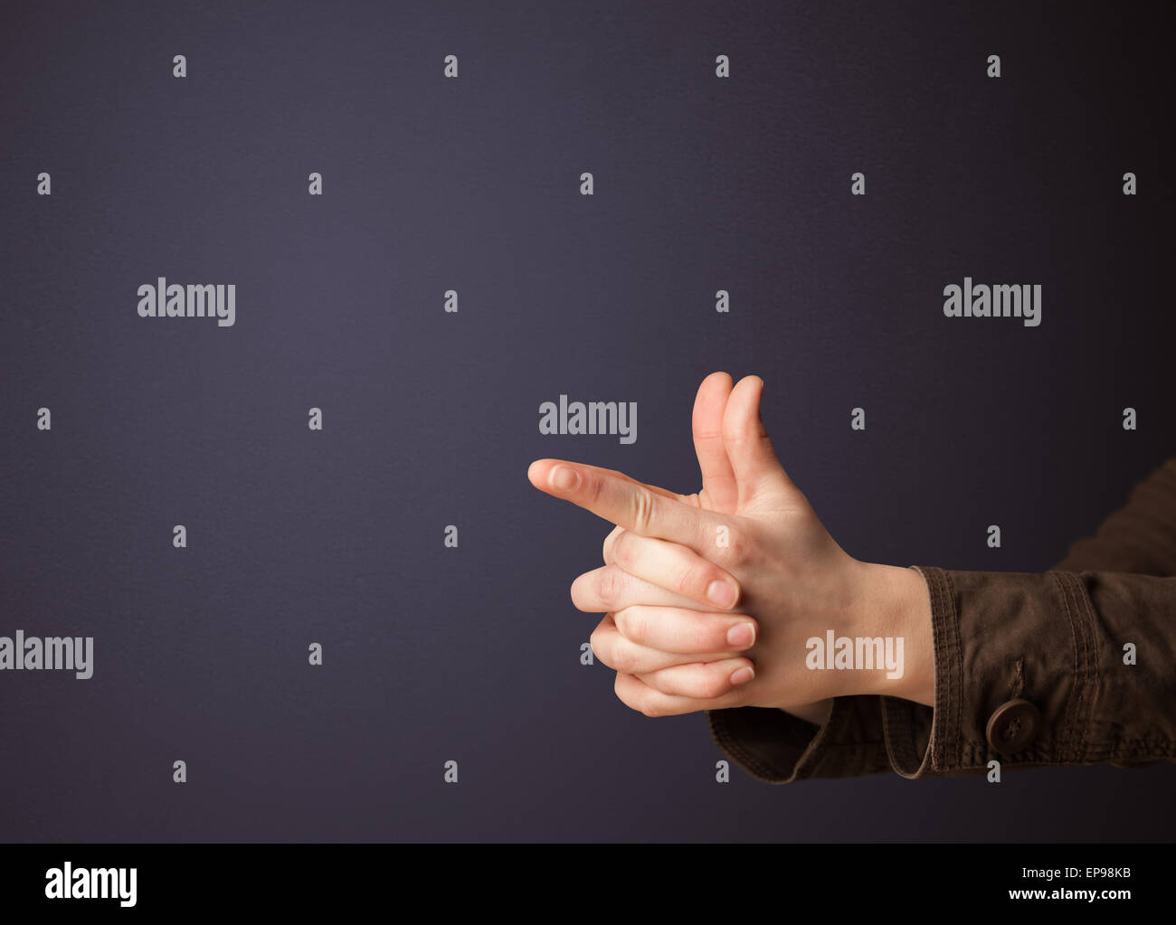 Gun shaped woman hand Stock Photo - Alamy