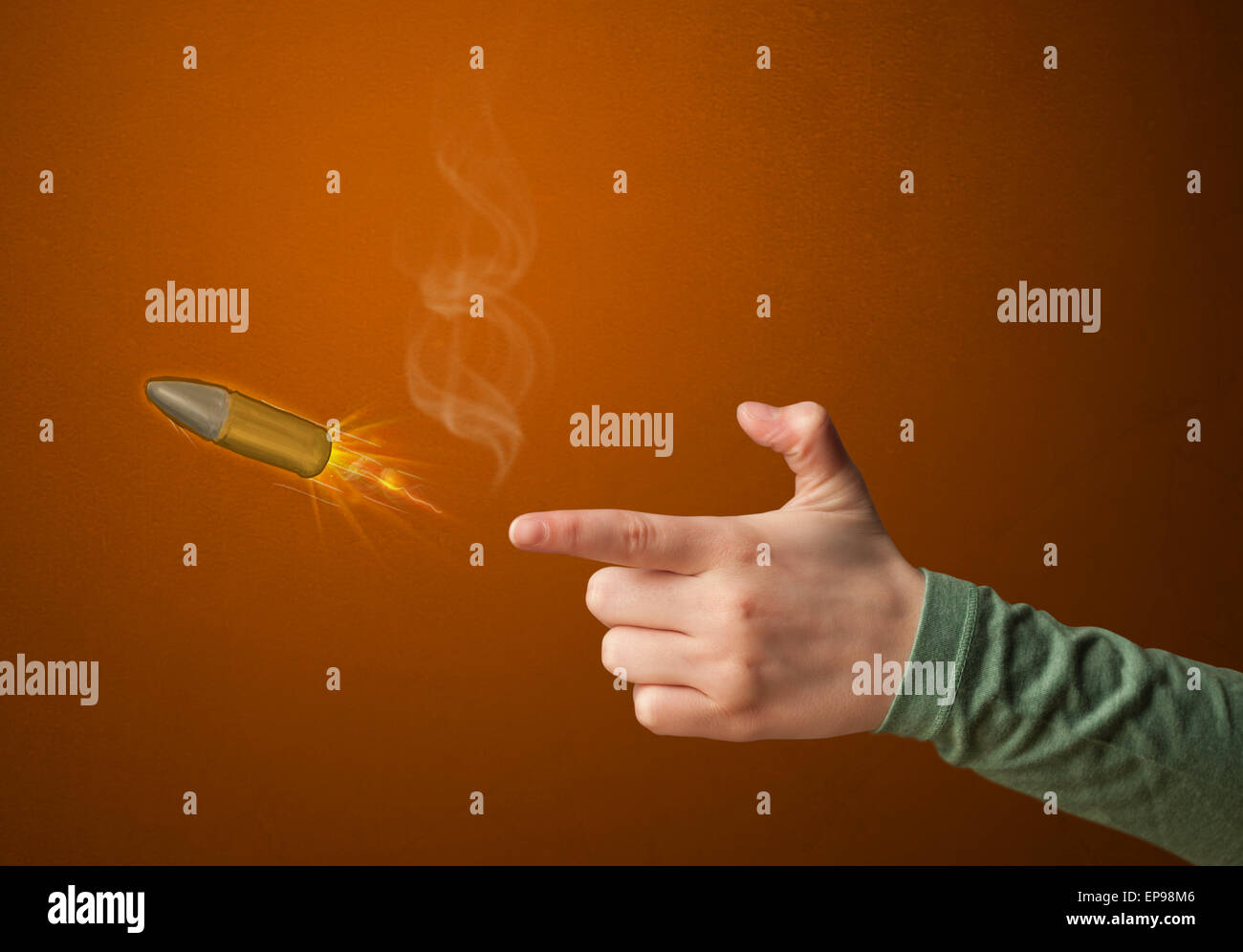 Gun shaped woman hand with bullet Stock Photo - Alamy