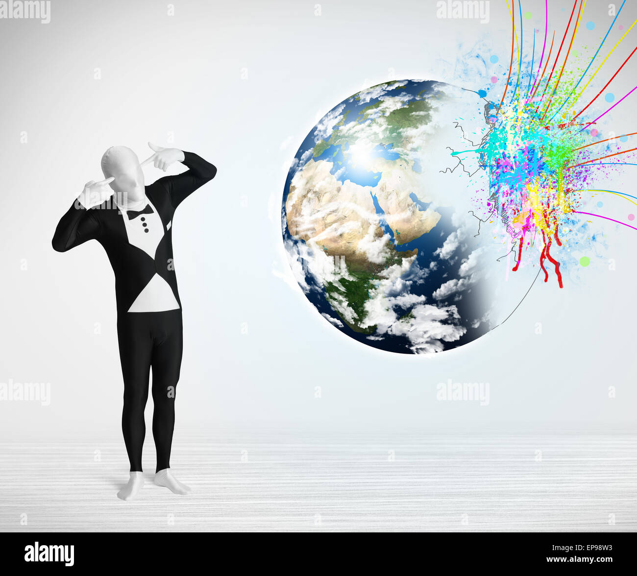 Funny man in body suit looking at colorful splatter earth Stock Photo ...