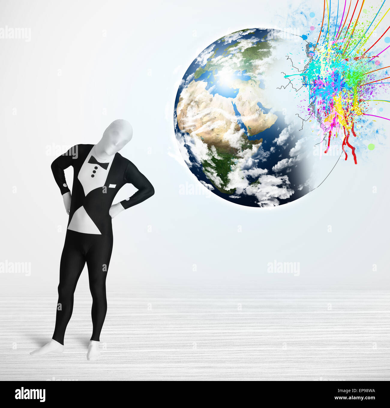 Funny man in body suit looking at colorful splatter earth Stock Photo ...