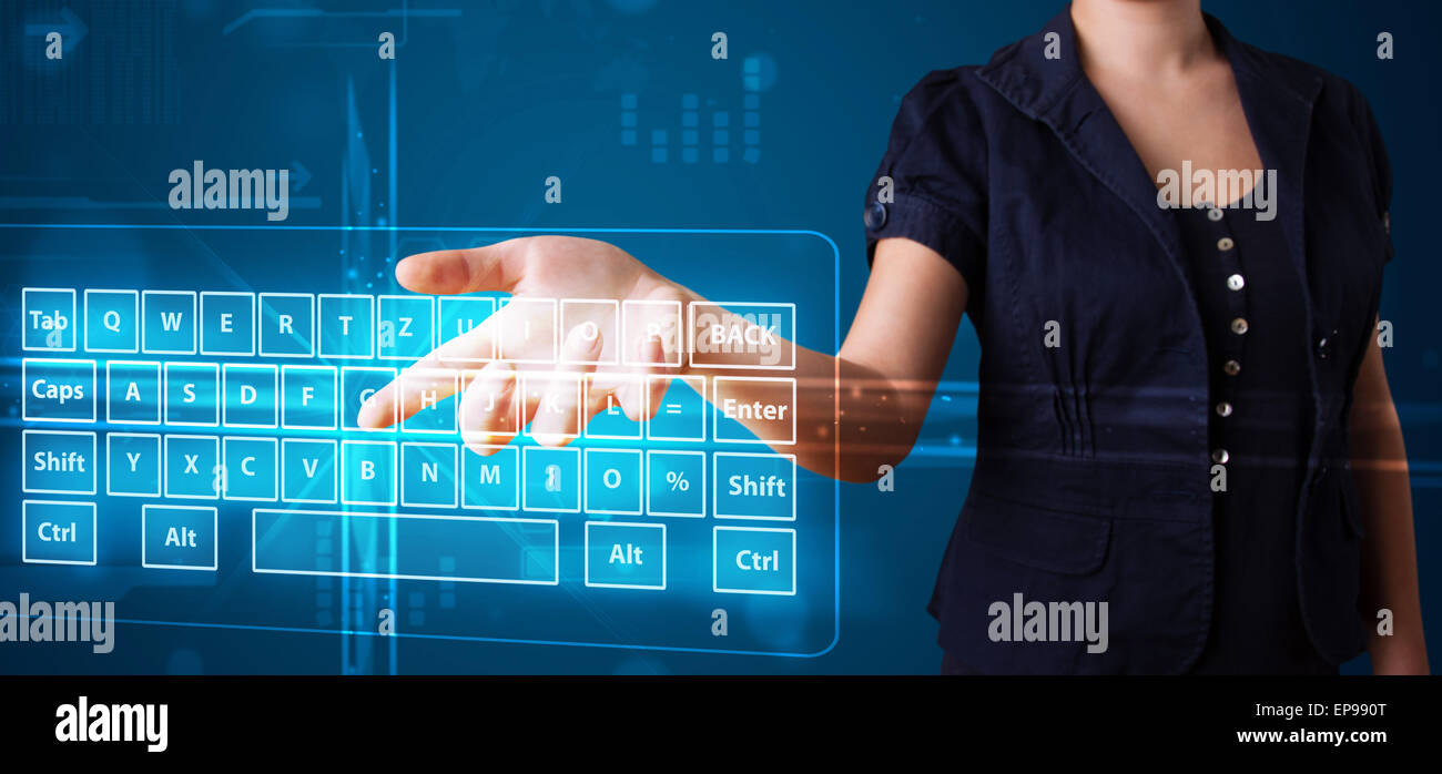 Girl pressing virtual type of keyboard Stock Photo - Alamy