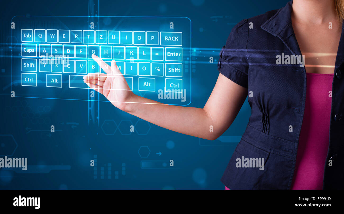 Girl pressing virtual type of keyboard Stock Photo - Alamy