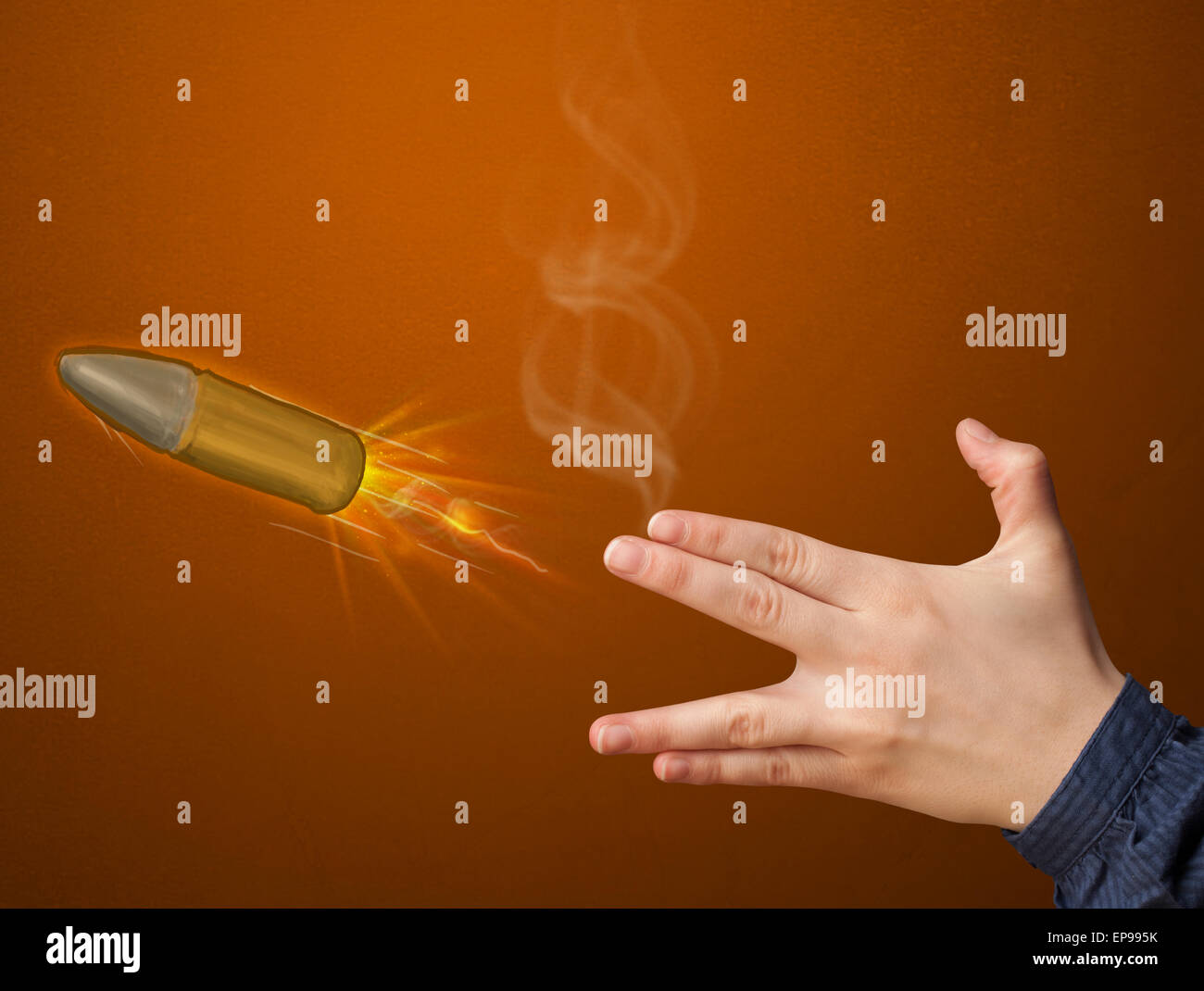 Gun shaped woman hand with bullet Stock Photo - Alamy