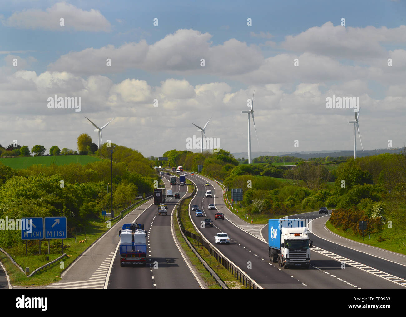 traffic passing electricity generating windmills by m18 motorway ...
