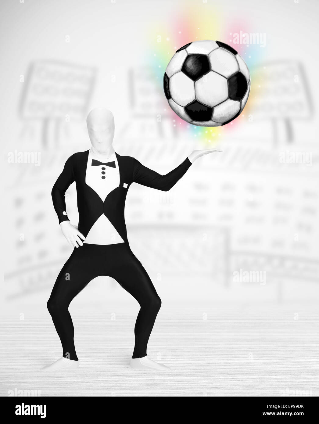 man in full body suit holdig soccer ball Stock Photo - Alamy