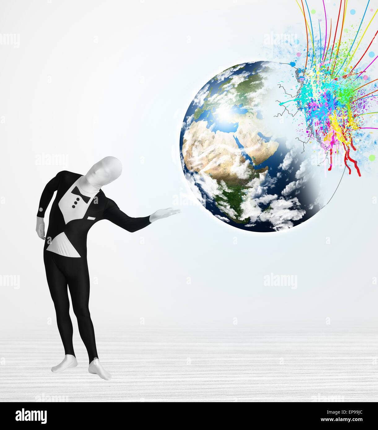 Funny man in body suit looking at colorful splatter earth Stock Photo ...