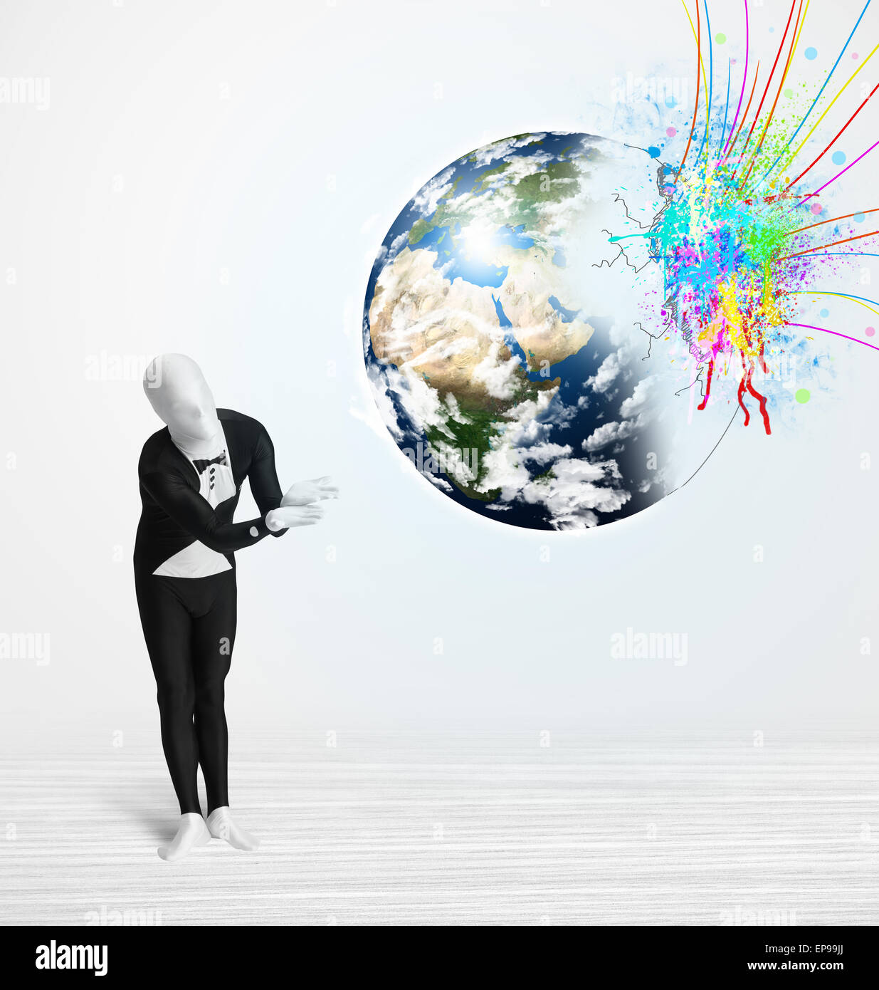 Funny man in body suit looking at colorful splatter earth Stock Photo ...