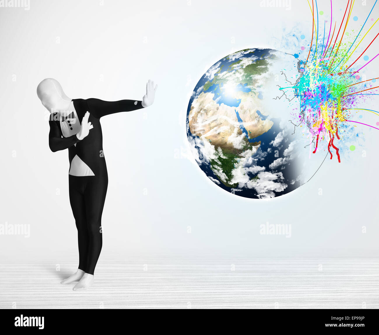 Funny man in body suit looking at colorful splatter earth Stock Photo ...