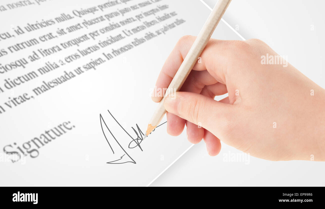 Hand writing personal signature on a paper form Stock Photo - Alamy