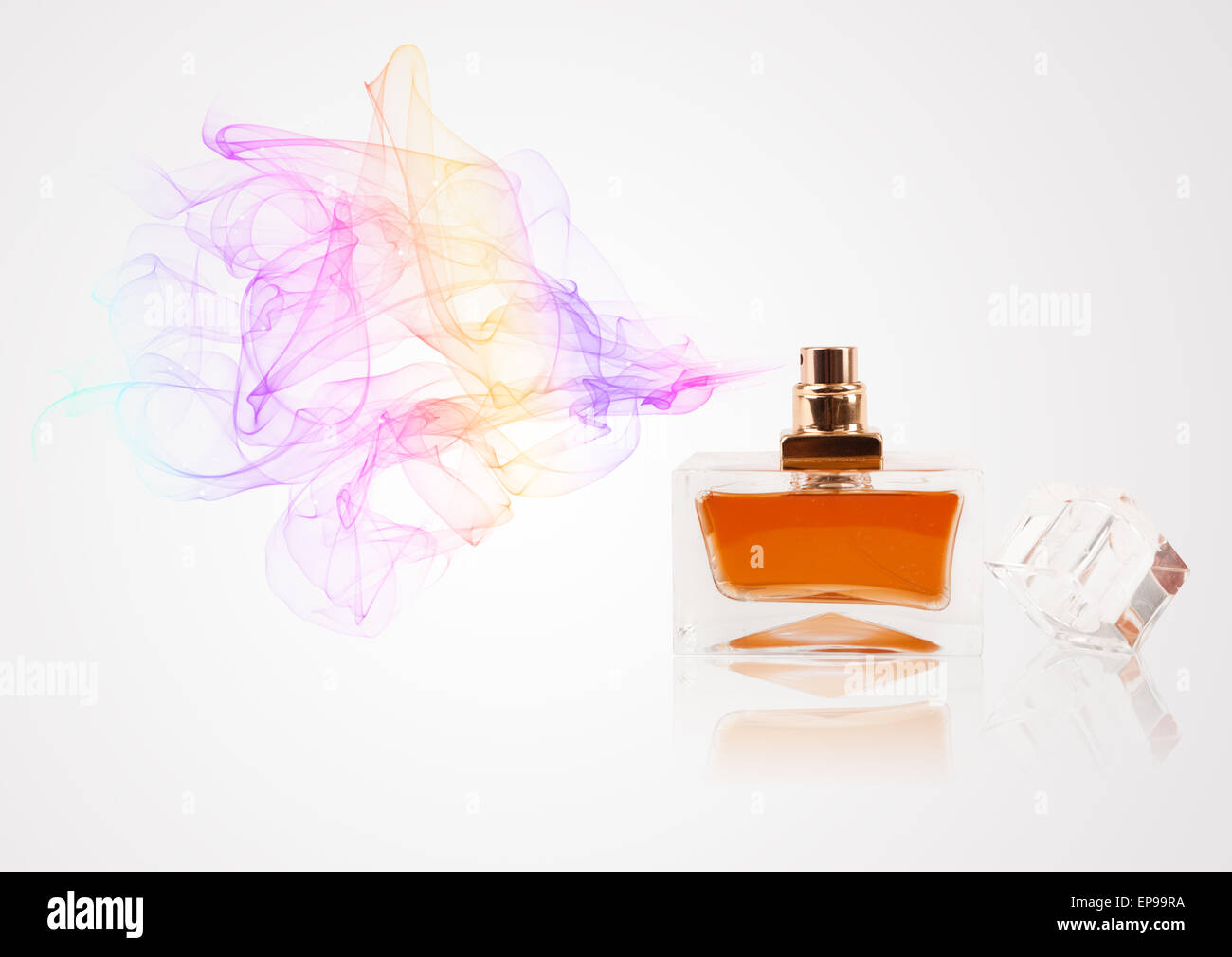 Perfume bottle spraying colored scent Stock Photo - Alamy