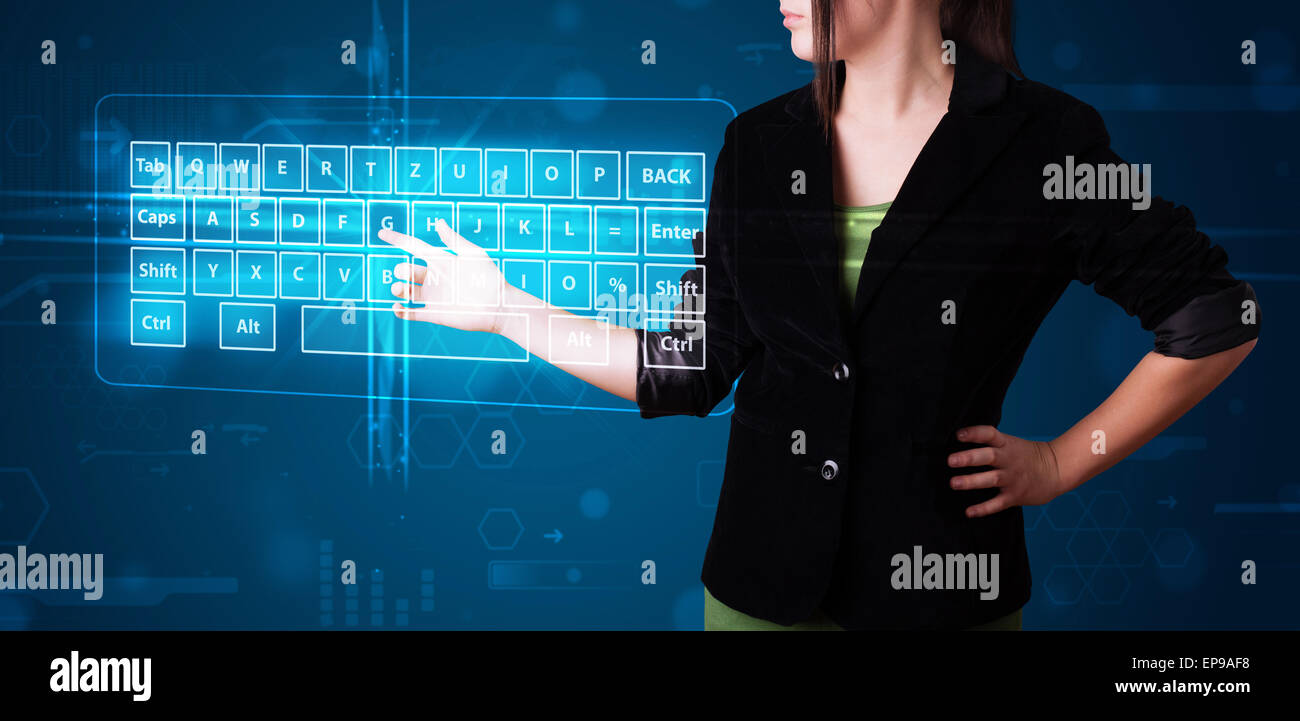 Girl pressing virtual type of keyboard Stock Photo - Alamy