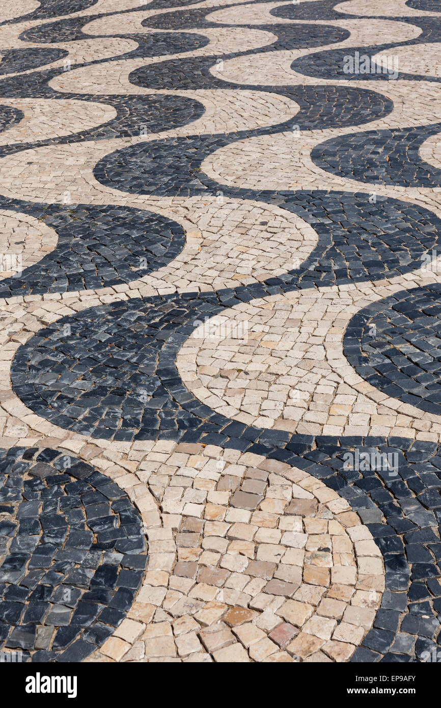 Typical portuguese cobblestone hand-made pavement calçada in Lisbon ...