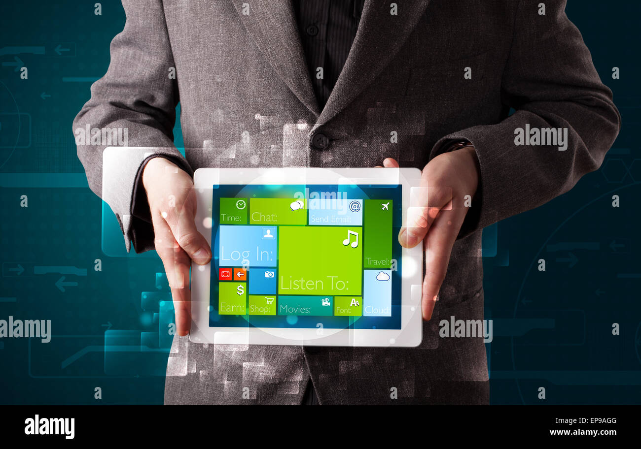 Businessman holding a tablet with modern software operational system ...