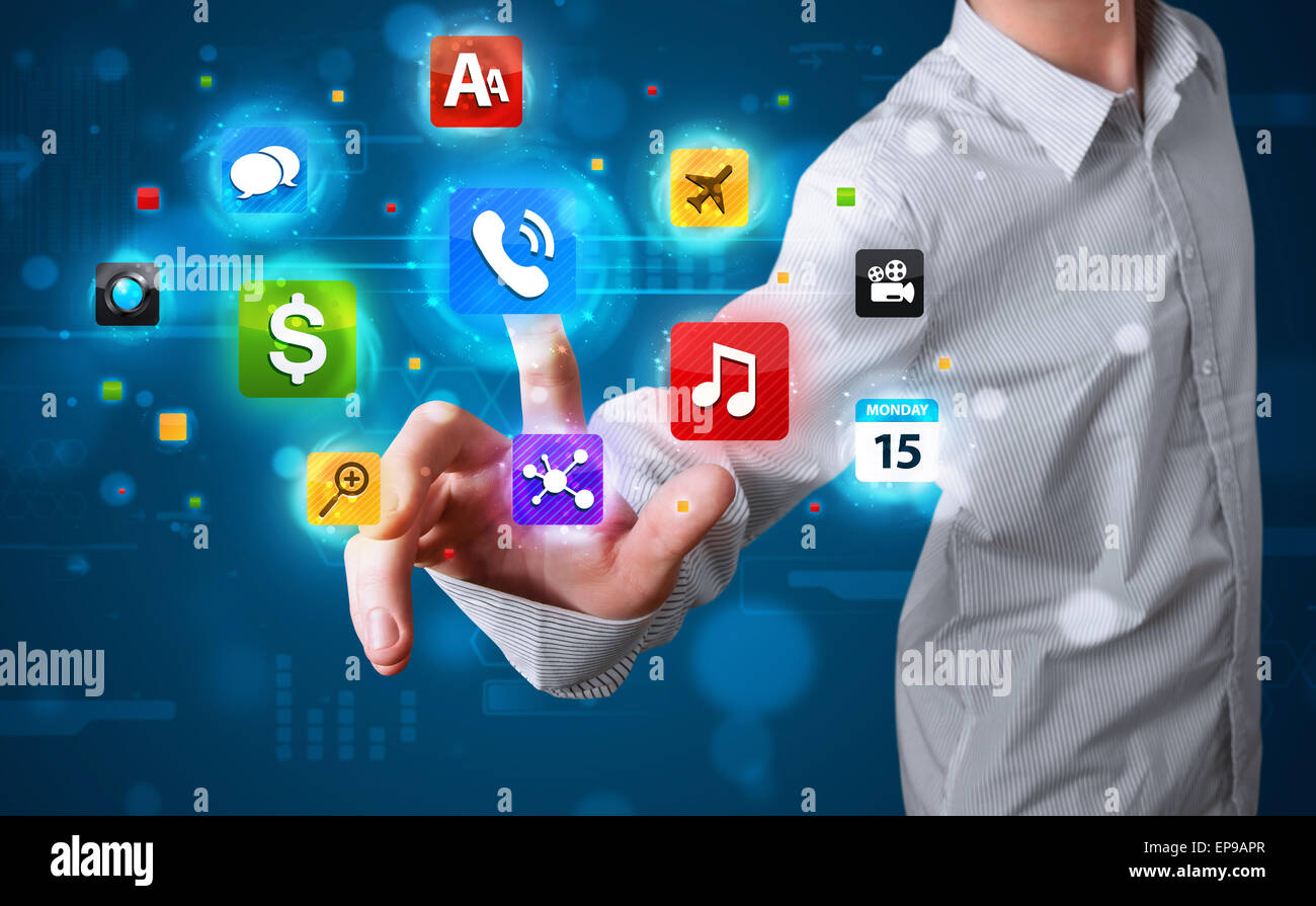 Man pressing various collection of high tech buttons Stock Photo - Alamy