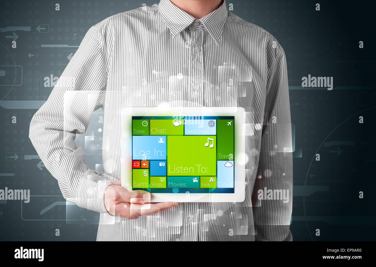 Businessman holding a tablet with modern software operational system ...