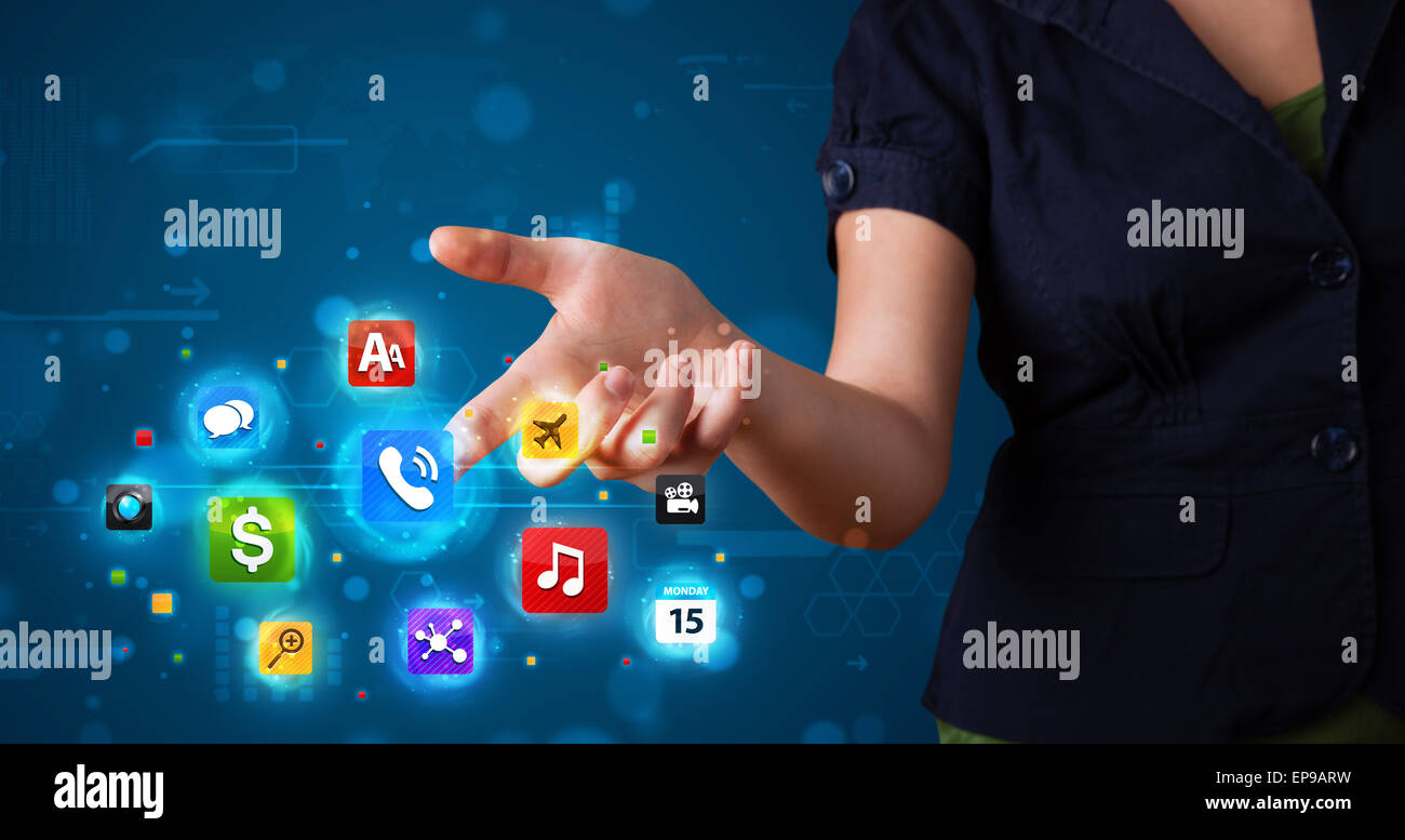 Woman pressing various collection of high tech buttons Stock Photo - Alamy