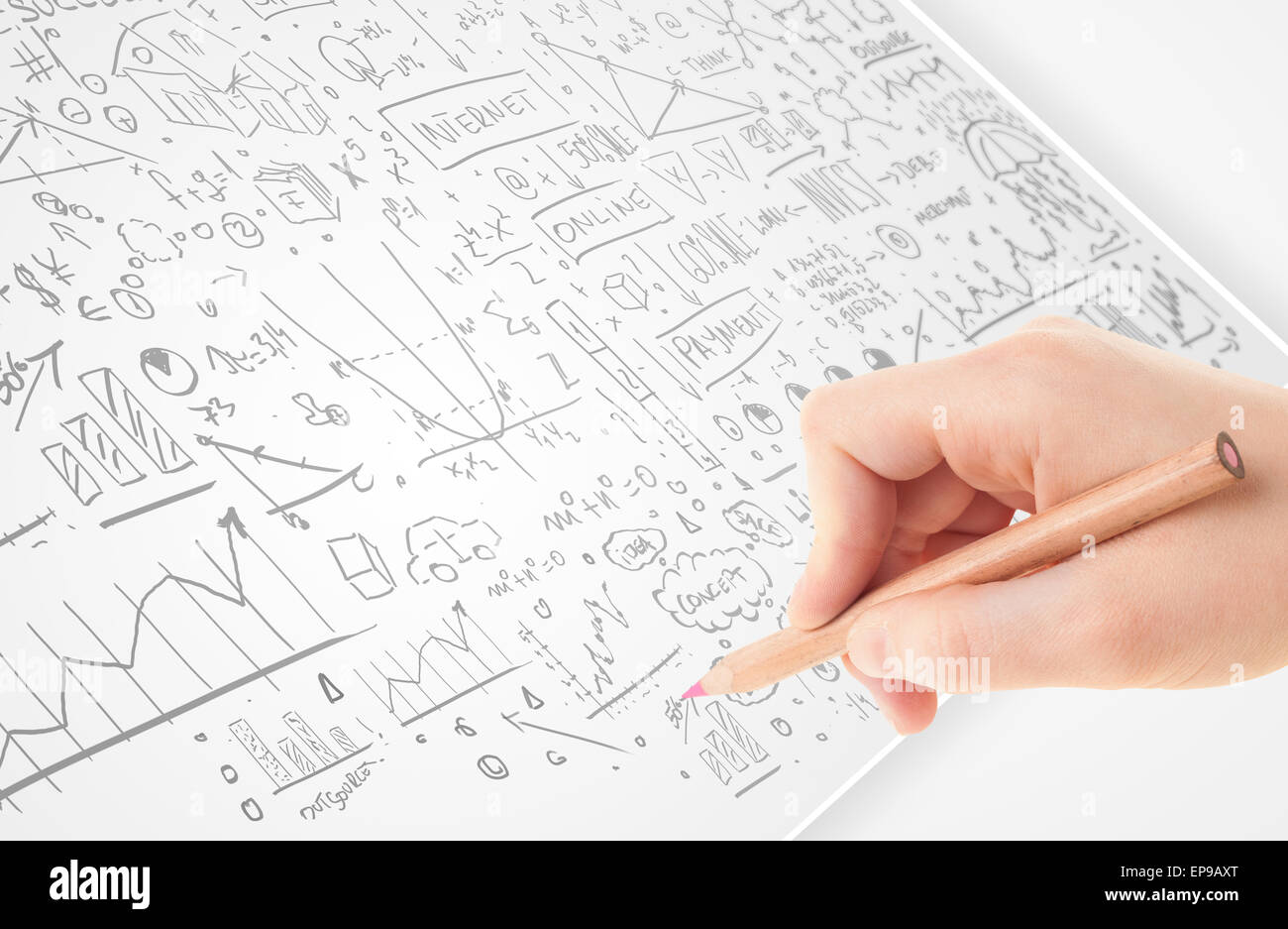 Human hand sketching ideas on a white paper Stock Photo - Alamy