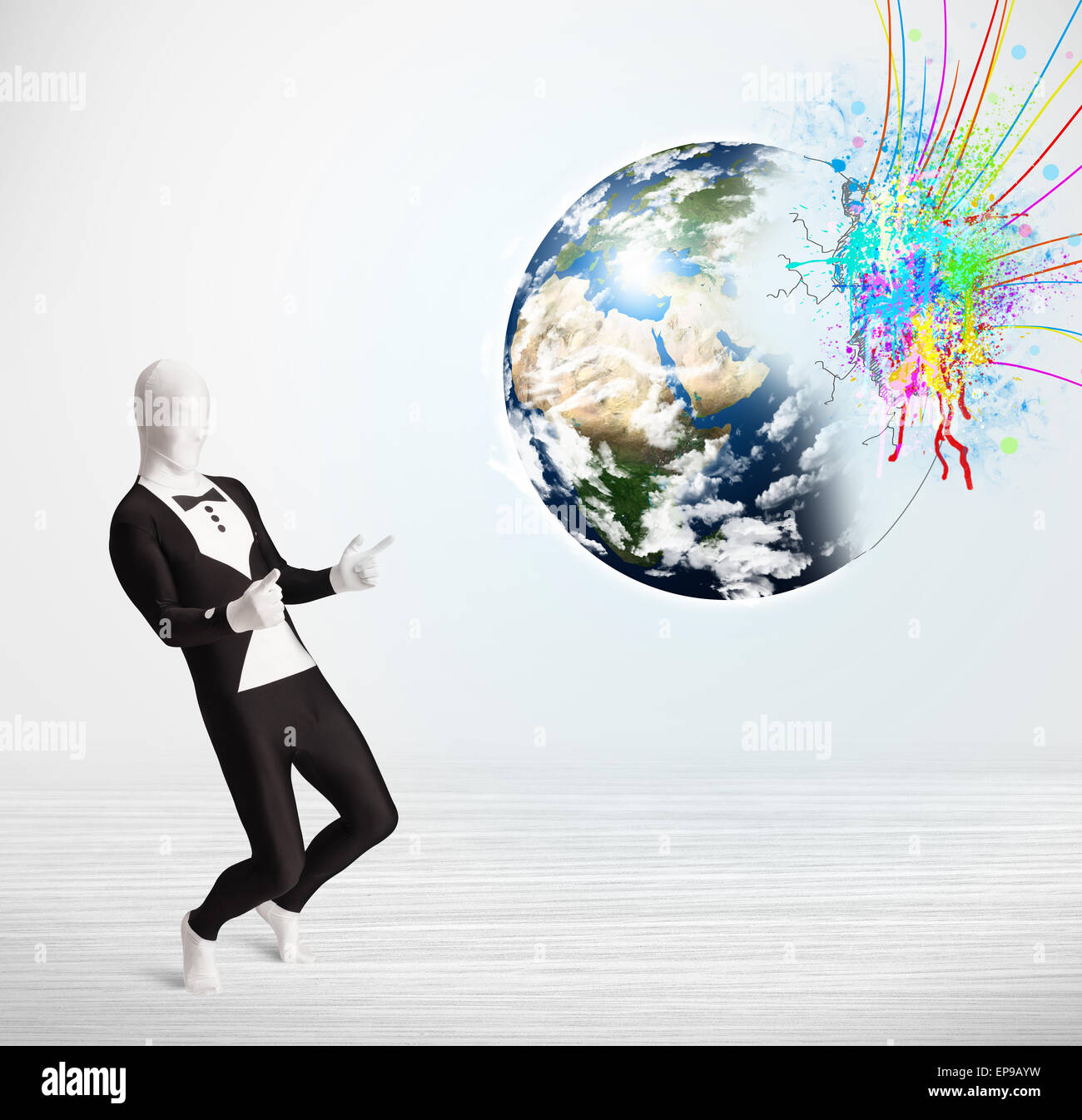 Funny man in body suit looking at colorful splatter earth Stock Photo ...