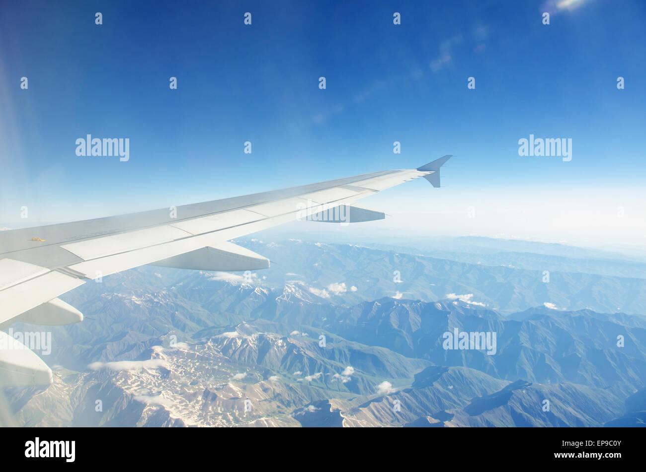 Airplane wing out of window Stock Photo - Alamy