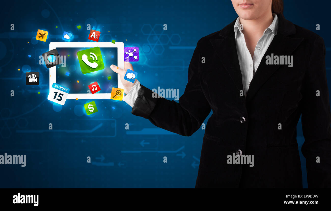 Lady holding a tablet with modern colorful apps and icons Stock Photo ...