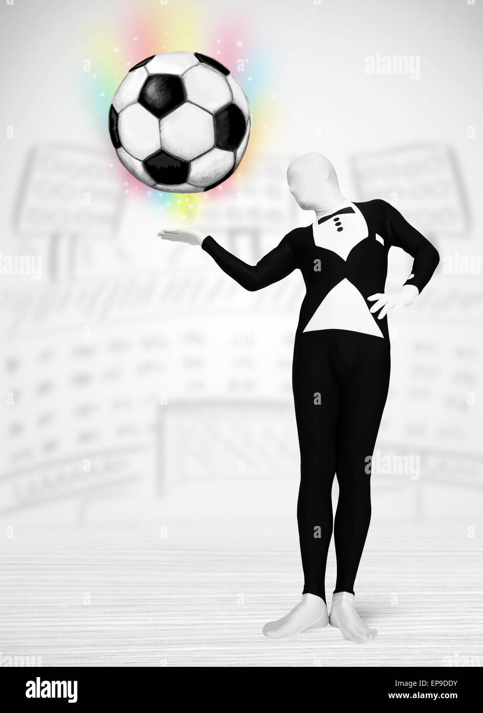 man in full body suit holdig soccer ball Stock Photo - Alamy