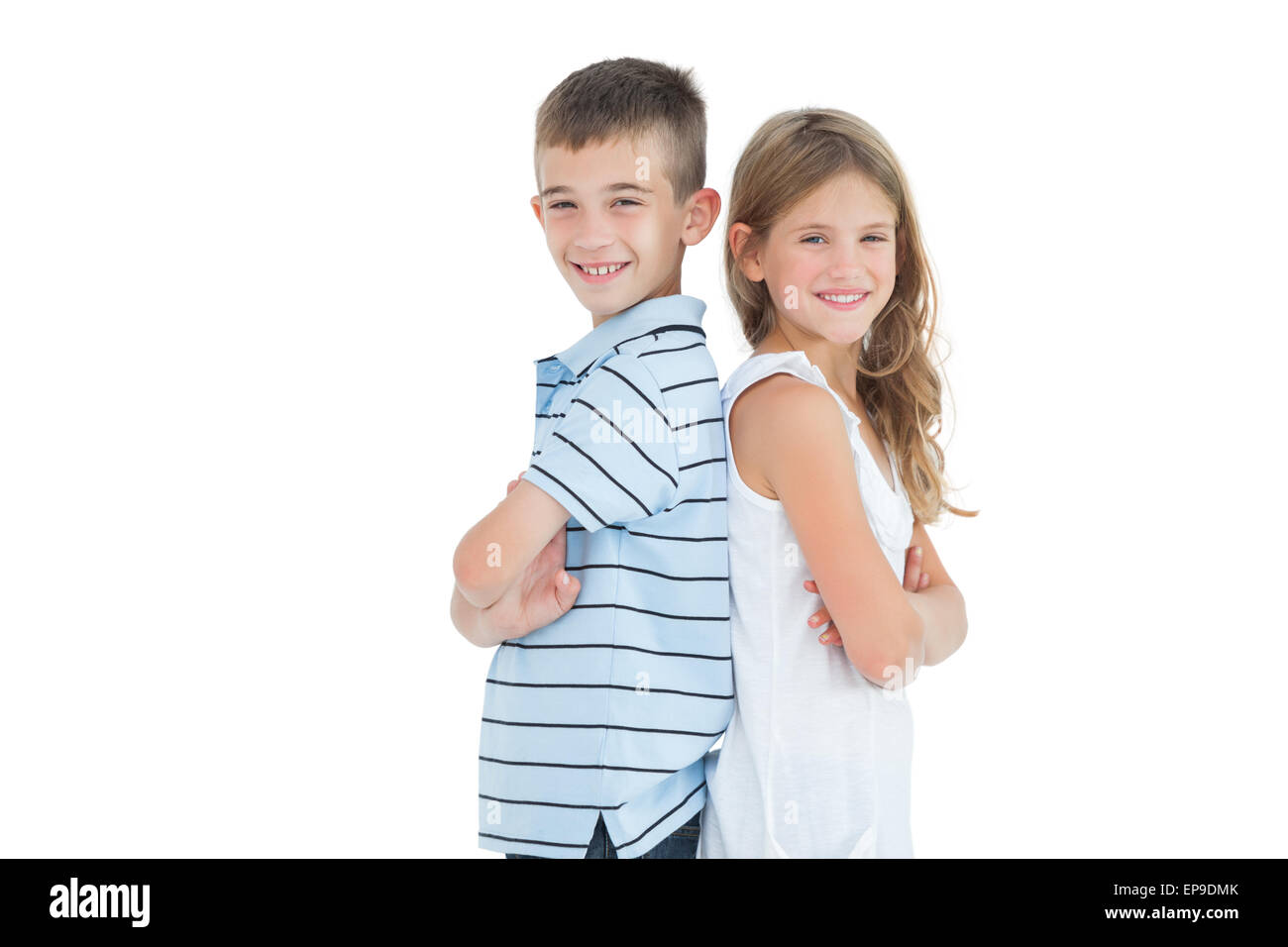 Happy young brother and sister posing back to back Stock Photo - Alamy