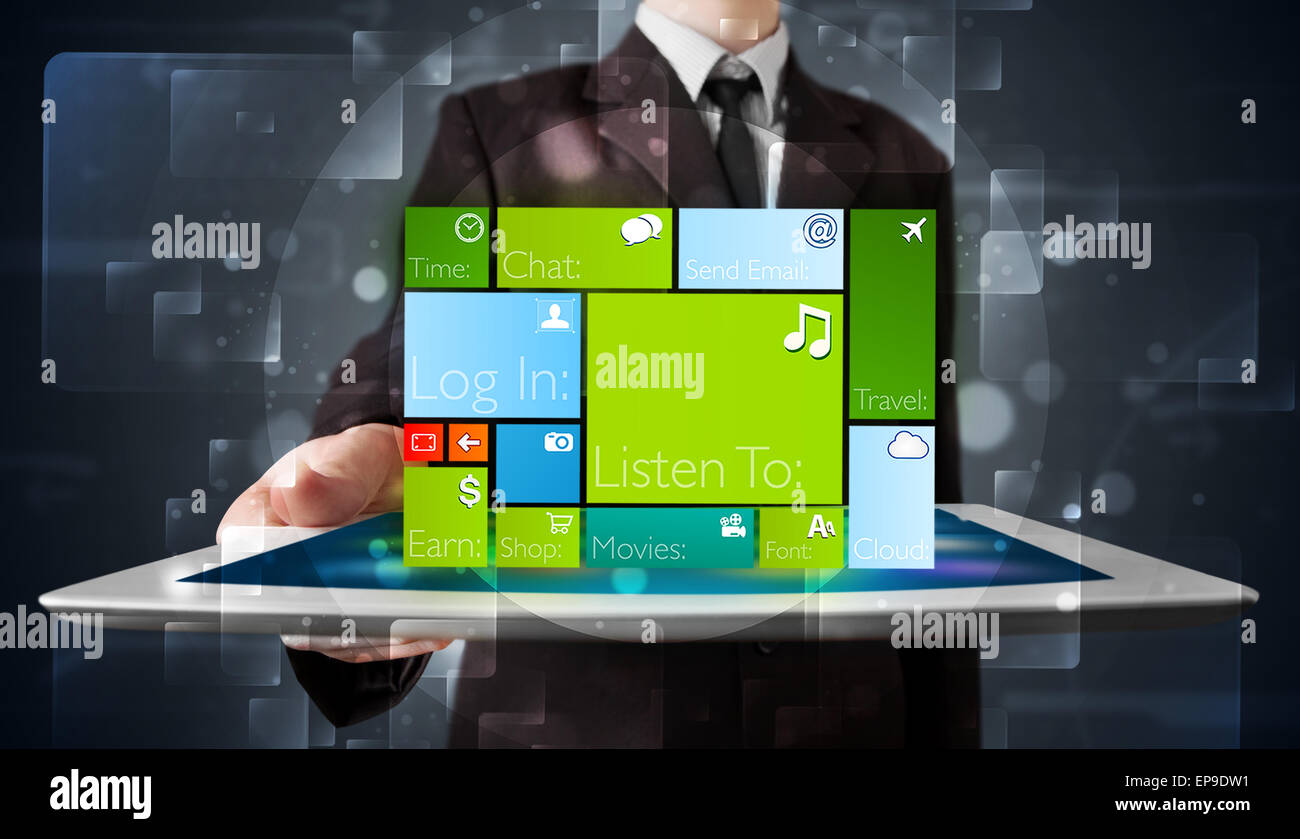 Businessman holding a tablet with modern software operational system ...