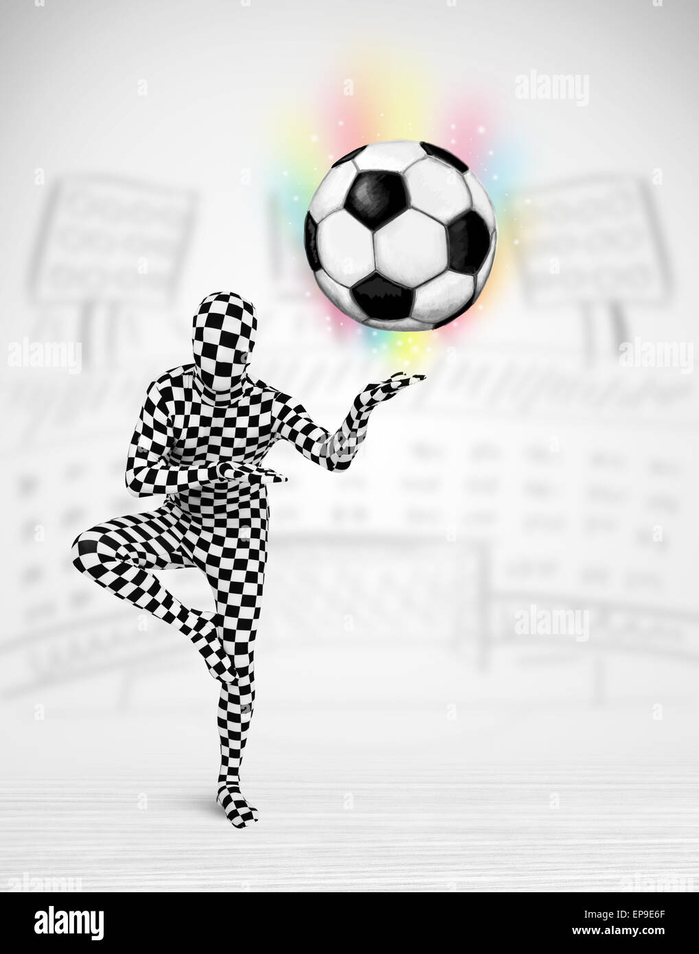 man in full body suit holdig soccer ball Stock Photo - Alamy