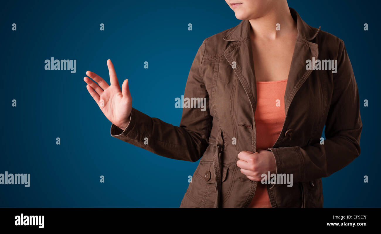 Woman pressing imaginary button Stock Photo - Alamy