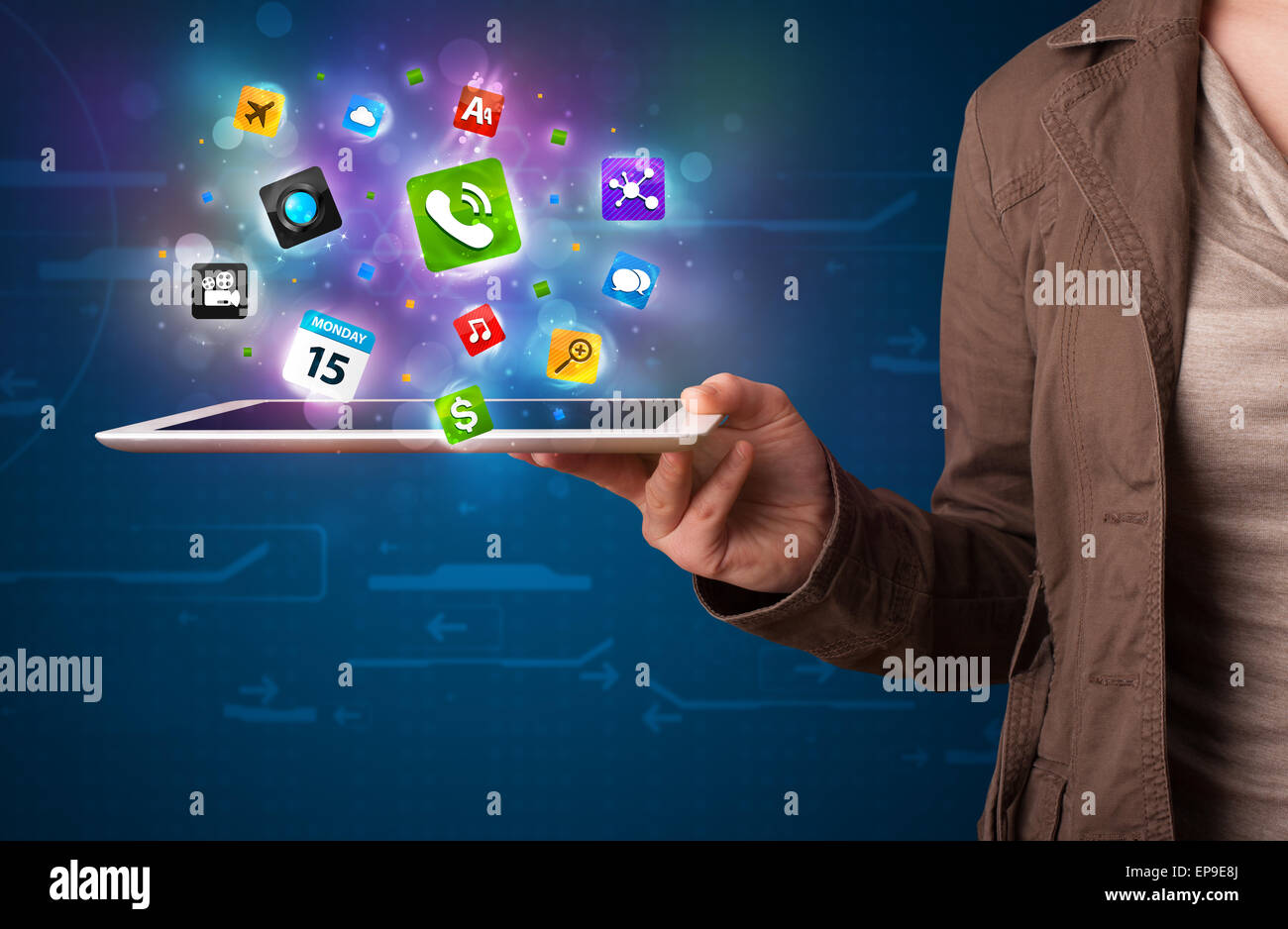 Lady holding a tablet with modern colorful apps and icons Stock Photo ...