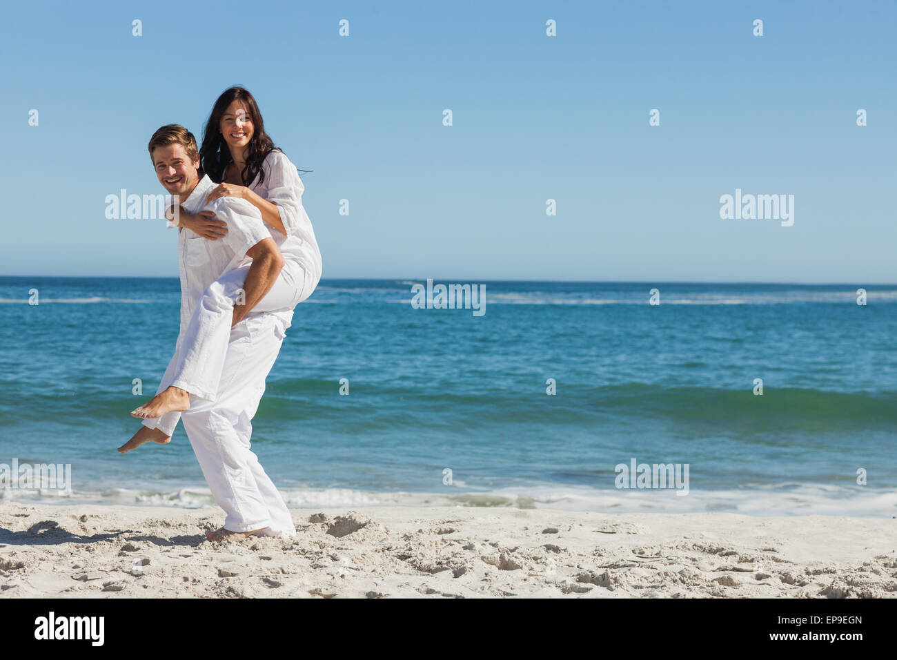 Woman sitting on mans back hi-res stock photography and images - Alamy