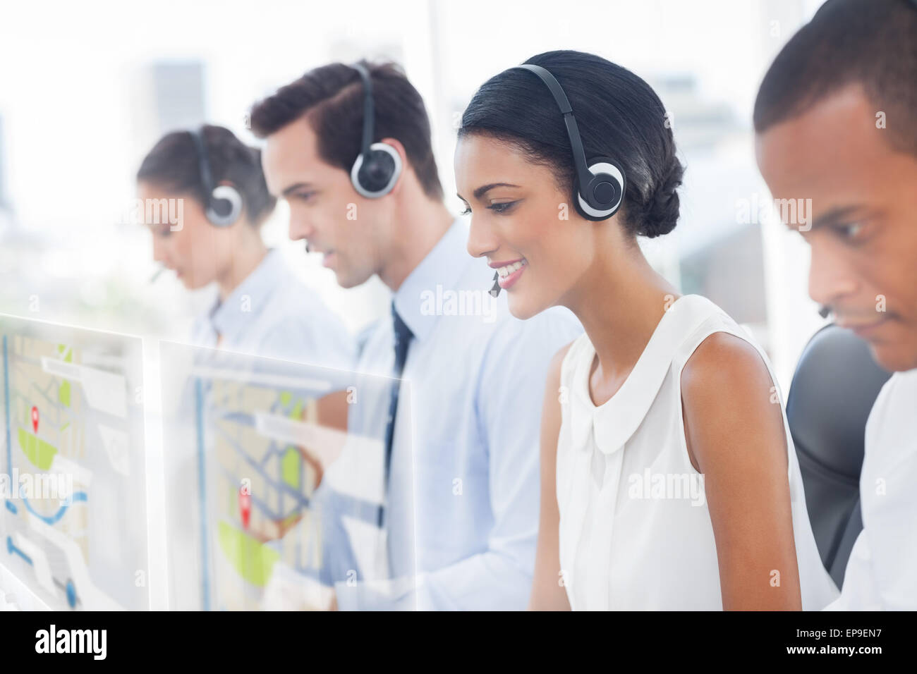 Call center employees at work on futuristic hologram interfaces Stock ...