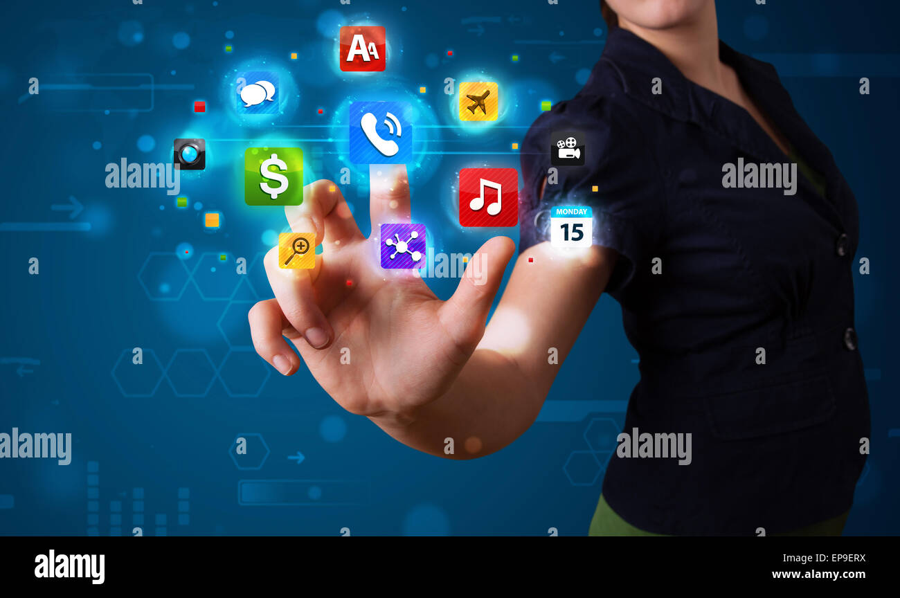 Woman pressing various collection of high tech buttons Stock Photo - Alamy