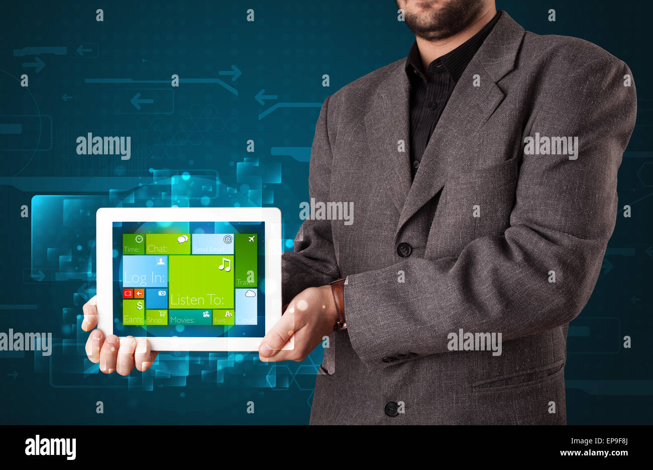 Businessman holding a tablet with modern software operational system ...