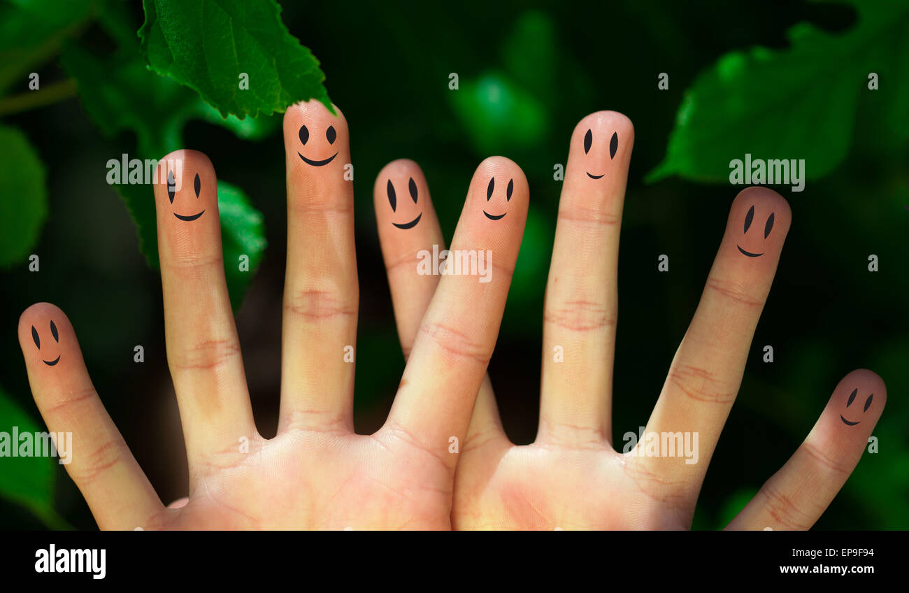 group of happy finger smileys in nature Stock Photo - Alamy