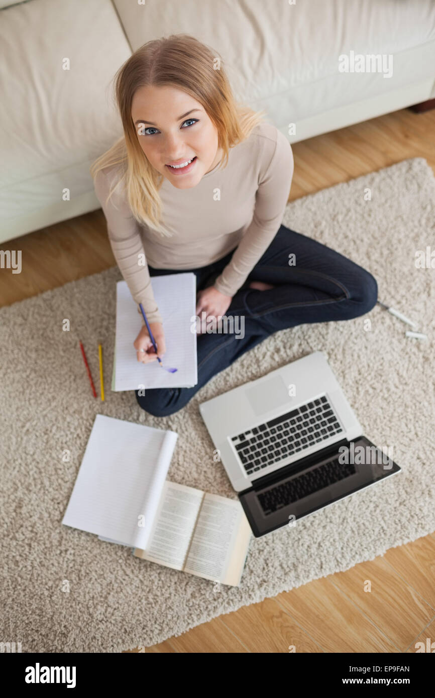 Happy female student doing homework hi-res stock photography and images ...