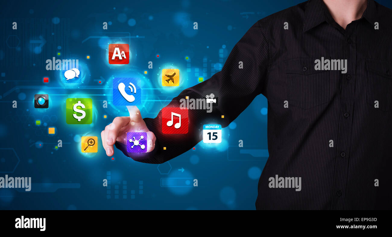 Man pressing various collection of high tech buttons Stock Photo - Alamy