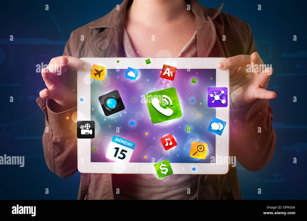 Lady holding a tablet with modern colorful apps and icons Stock Photo ...