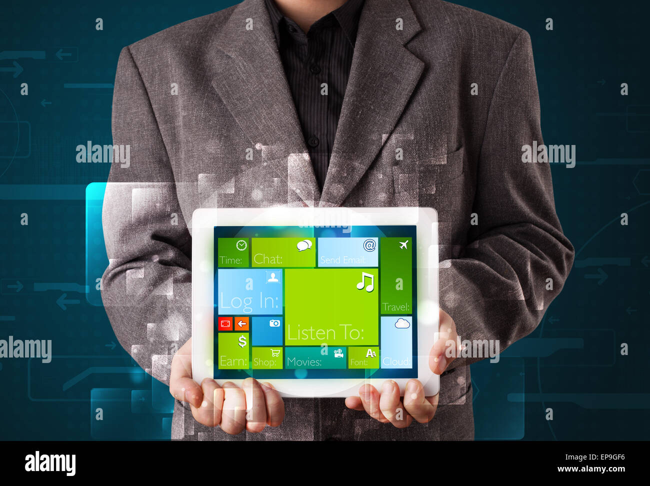 Businessman holding a tablet with modern software operational system ...