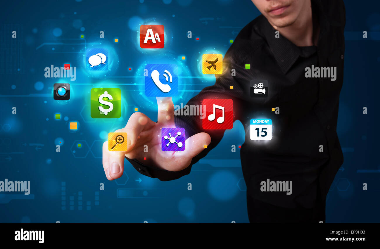 Man pressing various collection of high tech buttons Stock Photo - Alamy