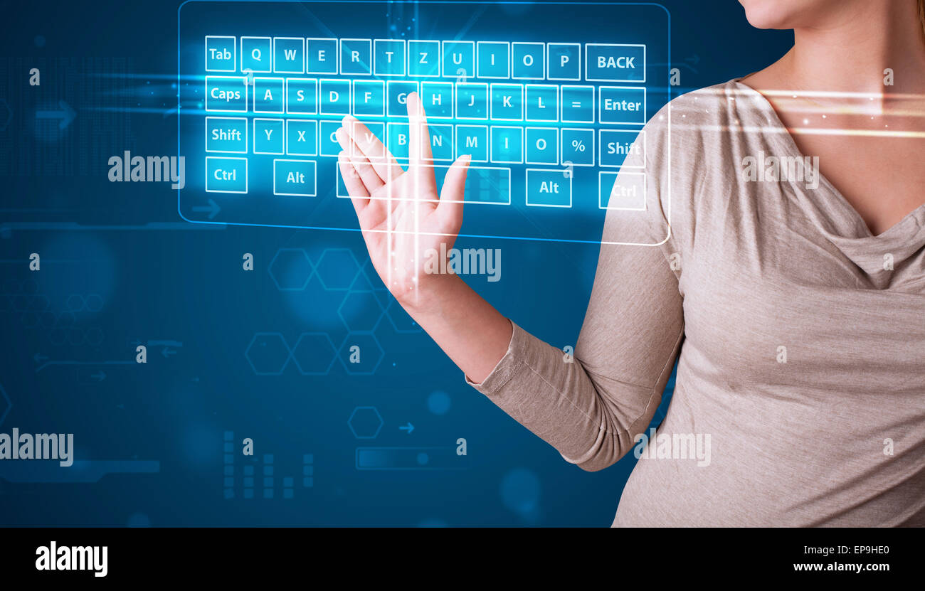 Girl pressing virtual type of keyboard Stock Photo - Alamy