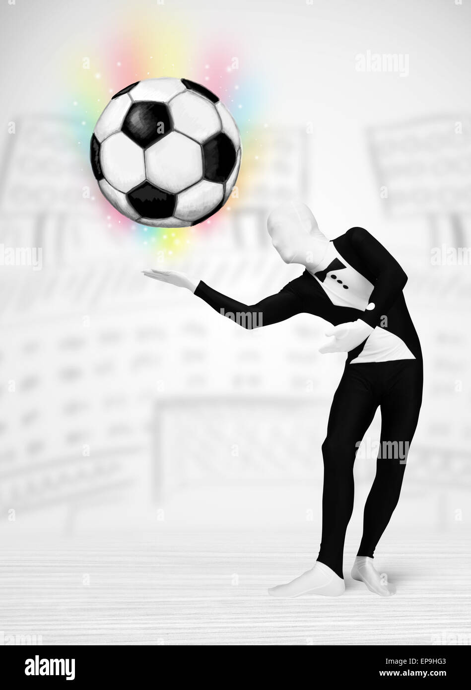 man in full body suit holdig soccer ball Stock Photo - Alamy