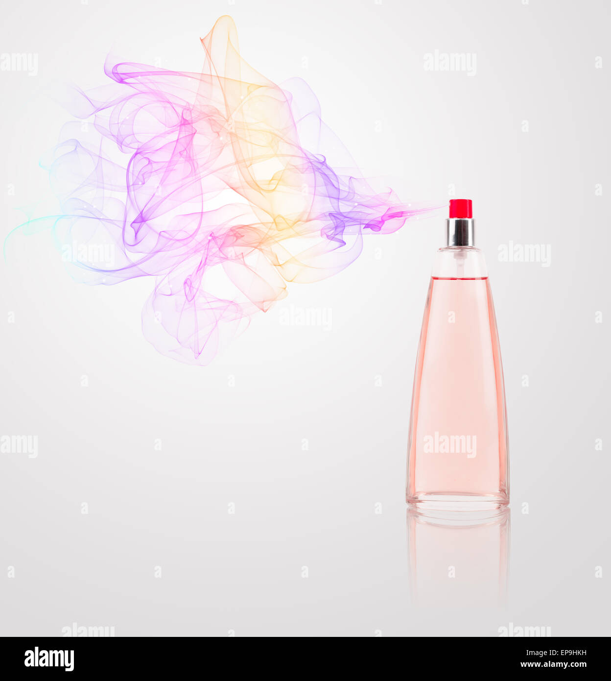 Perfume bottle spraying colored scent Stock Photo - Alamy