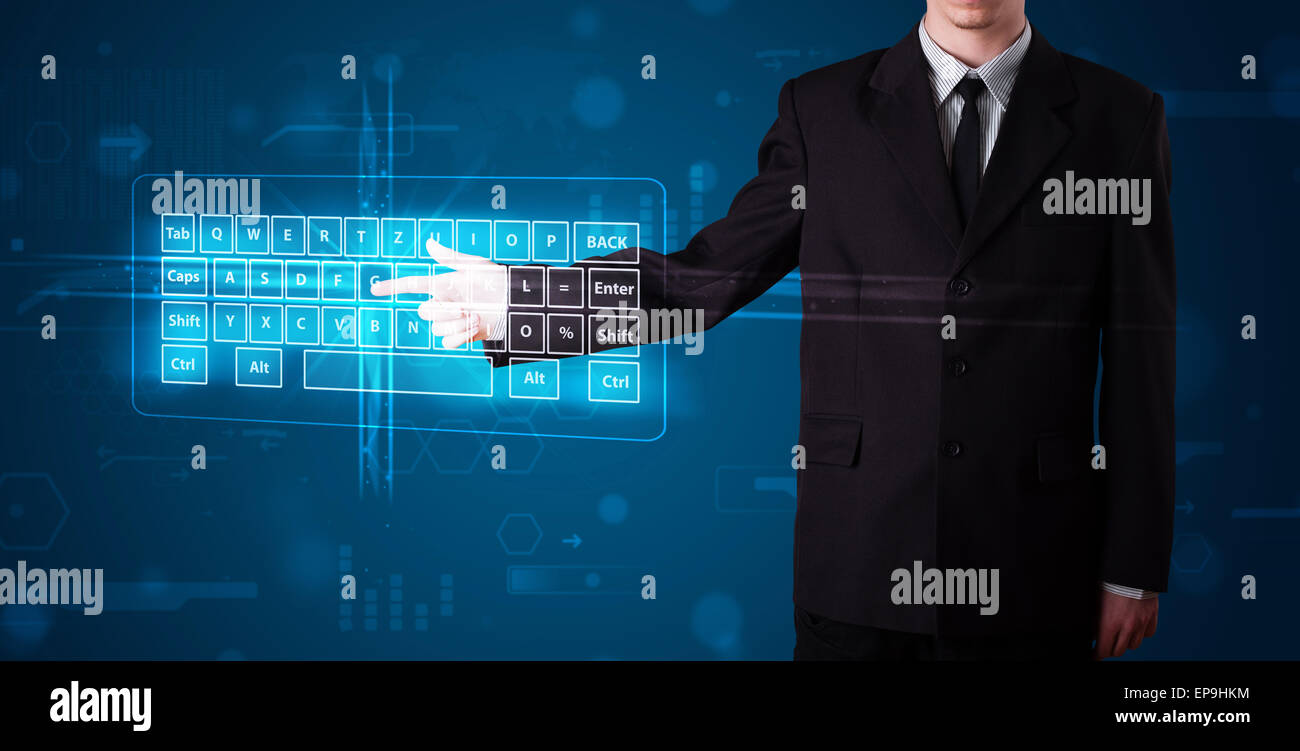 Businessman pressing virtual type of keyboard Stock Photo - Alamy