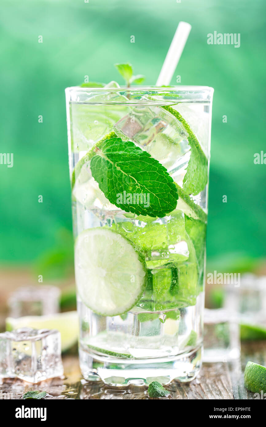 Ice cold cocktail with lime and mint Stock Photo - Alamy